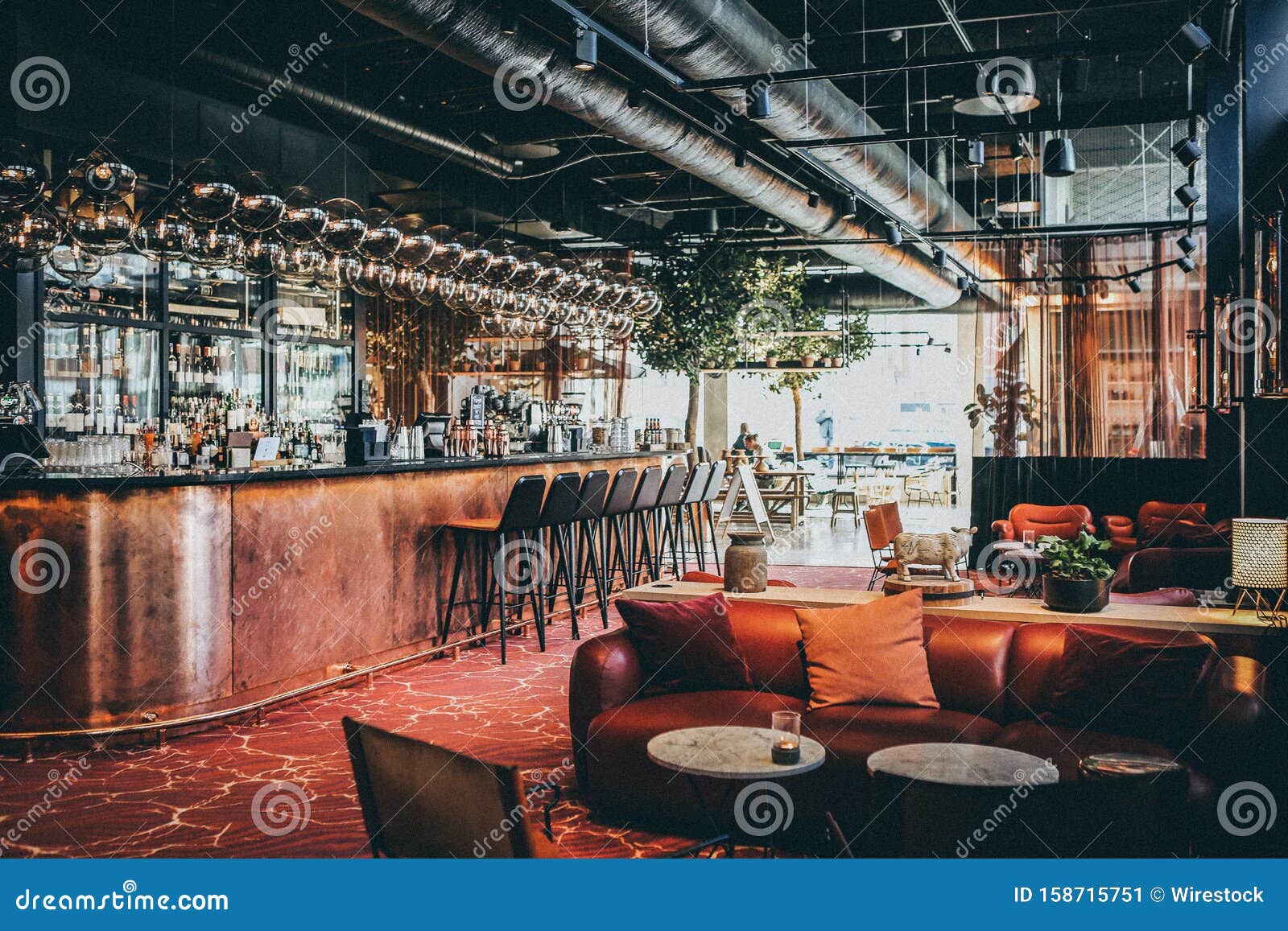 Empty Hotel Lounge with Black Chairs, Brown Couches, and Beautiful ...