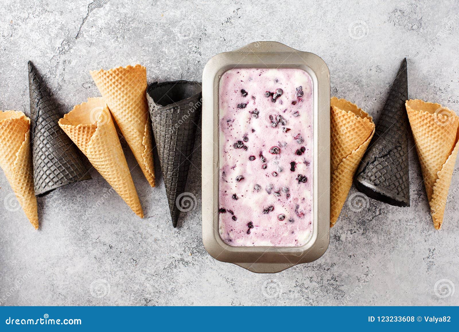 Empty Ice Cream Waffle Cones And Berry Ice Cream On Grey Textured