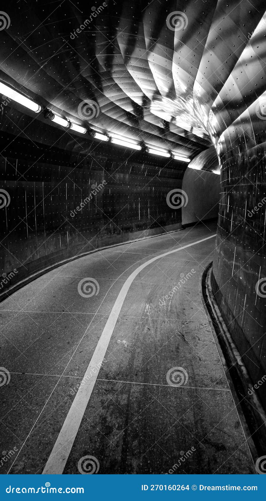 Empty Illuminated Tunnel in Black and White Stock Photo - Image of ...