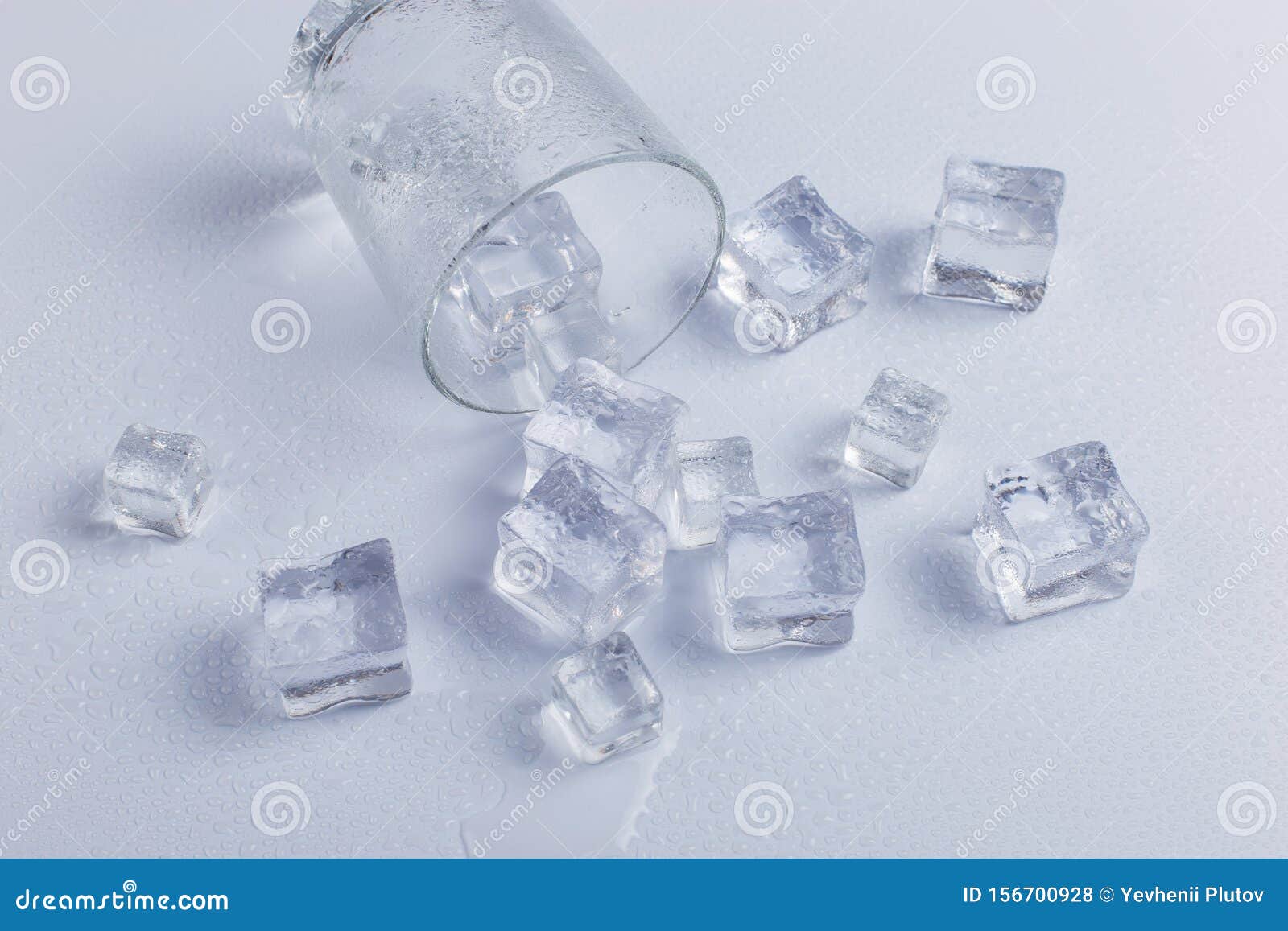 Empty Inverted Fallen Glass with Ice, on a White Background Stock Photo ...