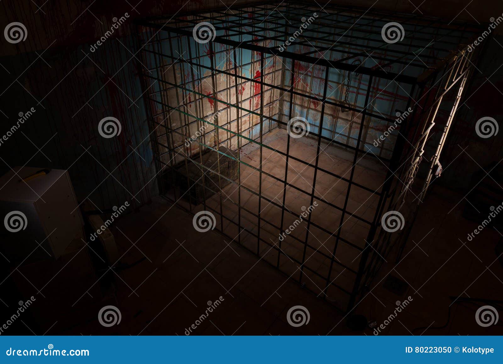 Empty Iron Cage in Basement with Blood Splattered Wall Stock Photo ...