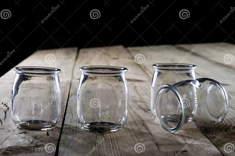 Empty Jars on a Wooden Table, Black Background Stock Photo - Image of ...