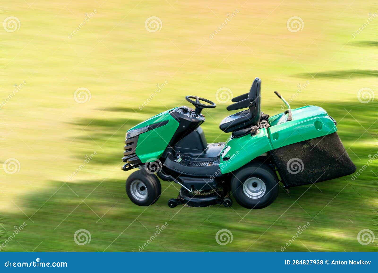 Empty Lawn Mower on a Blurred Background. Stock Photo - Image of field ...
