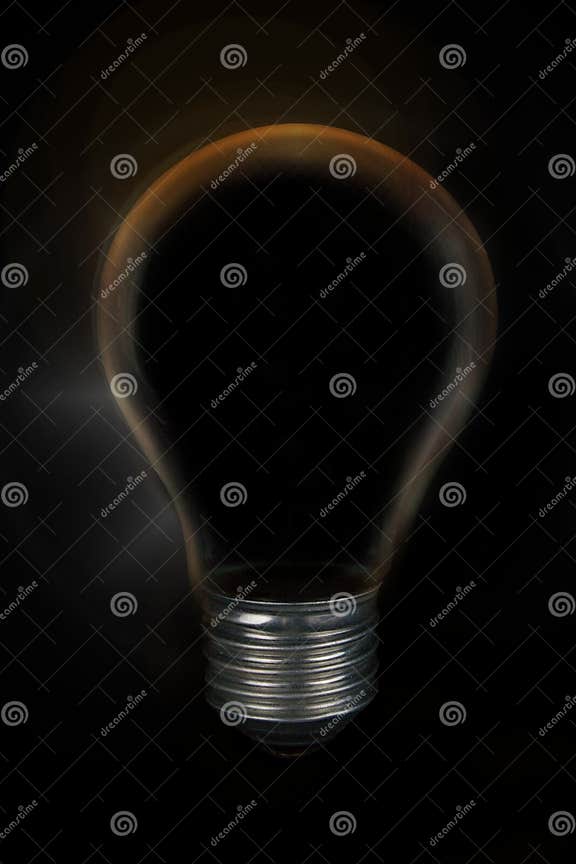 Empty Light Bulb in Front of Black Background. Stock Image - Image of ...