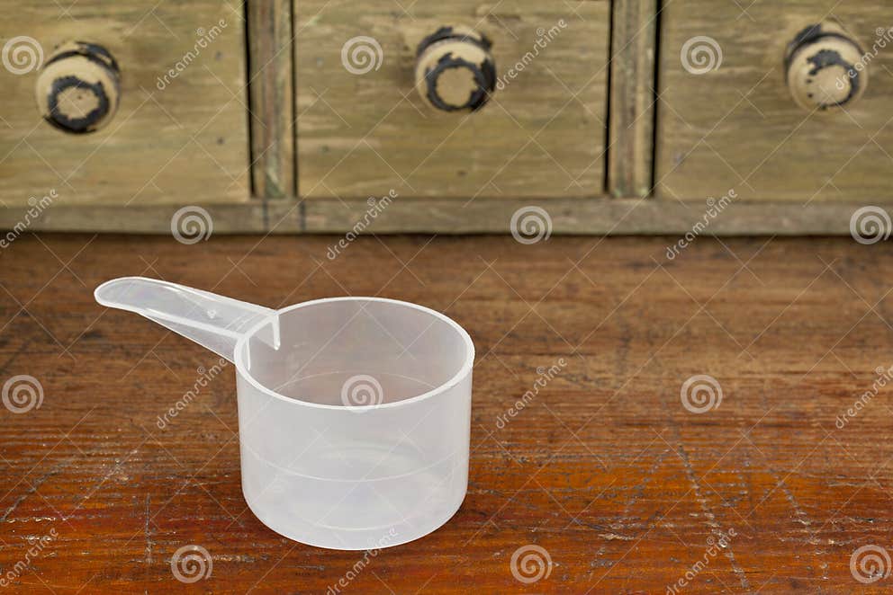 Empty measuring cup stock image. Image of scratched, wood - 24901775
