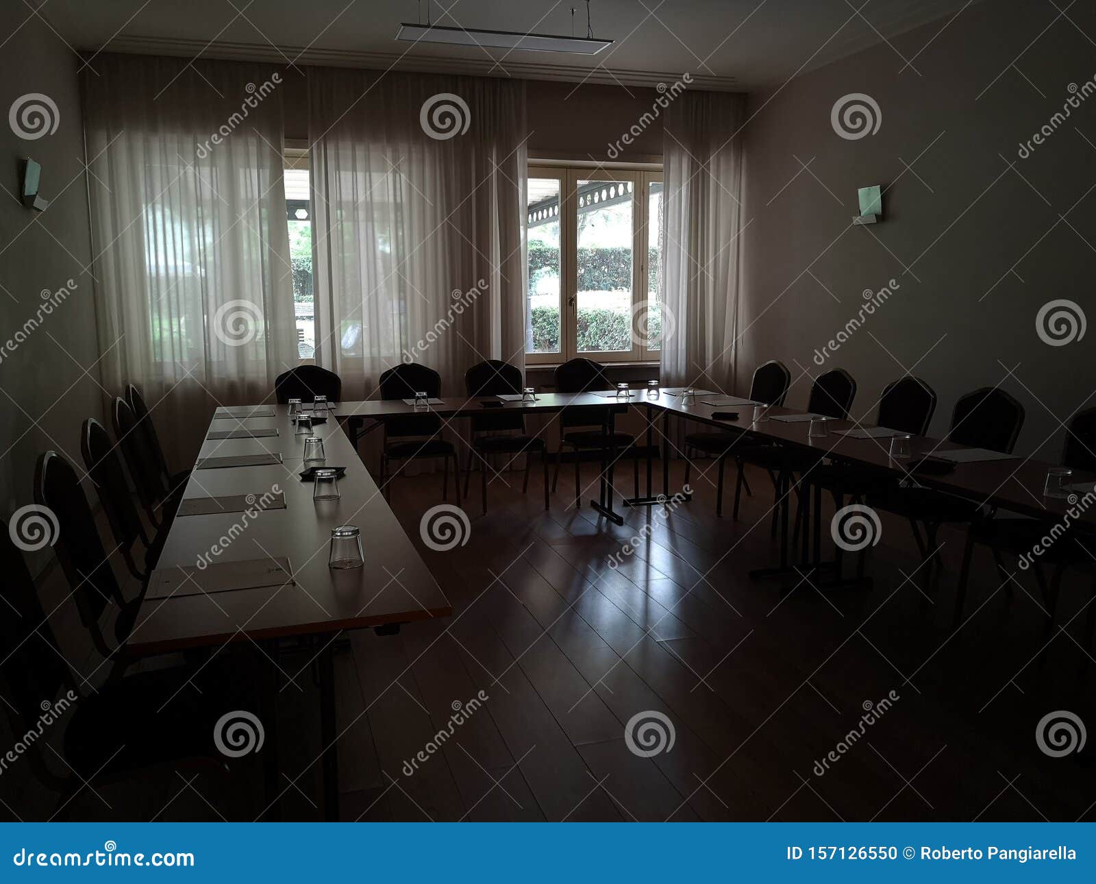 Empty Meeting Room in Dim Light Stock Photo - Image of seminar, meeting ...