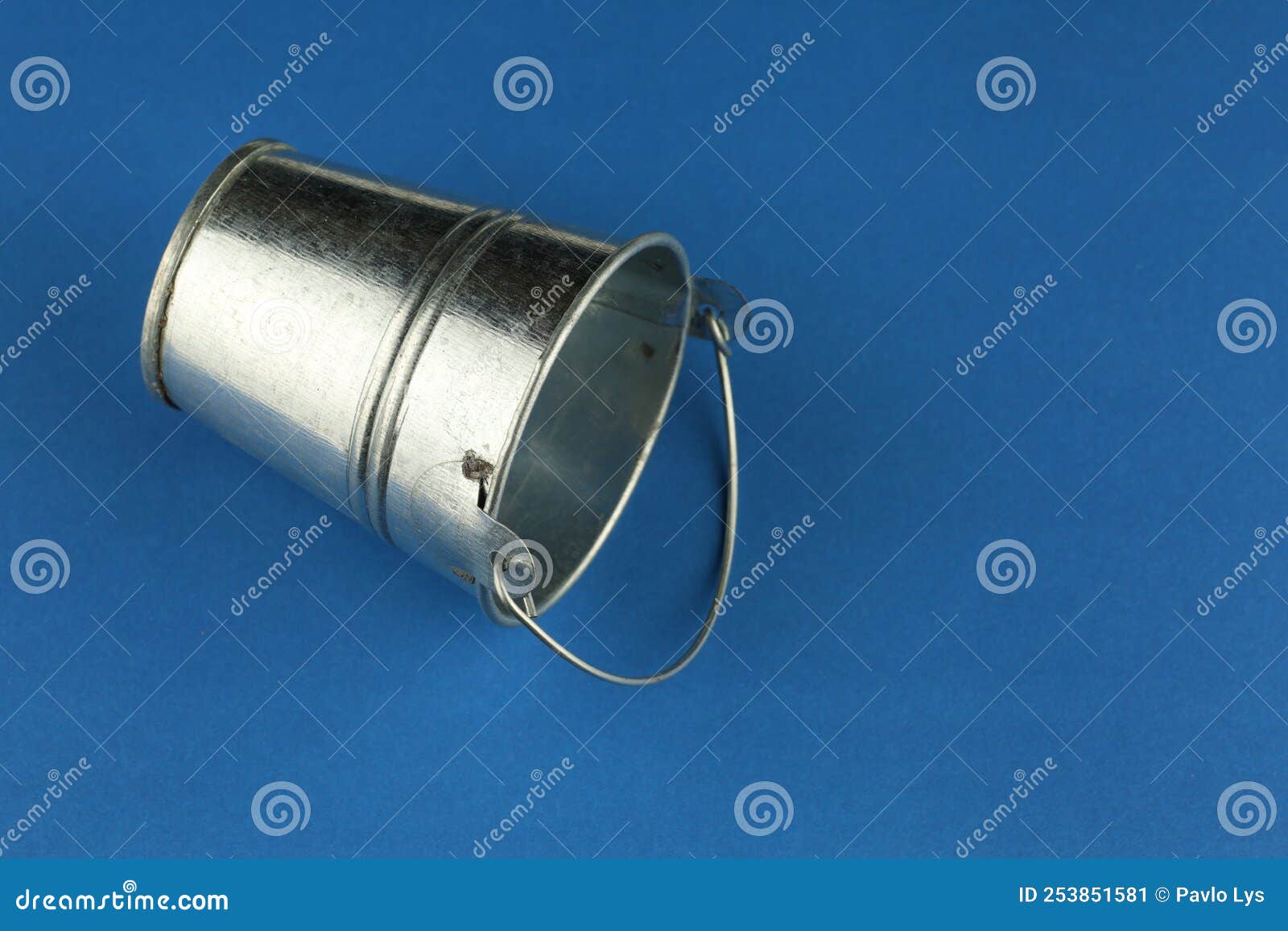 Empty Metal Bucket on a Blue Background Stock Image - Image of white ...