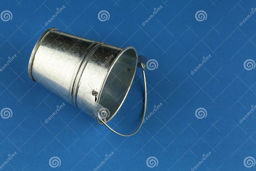 Empty Metal Bucket on a Blue Background Stock Image - Image of white ...