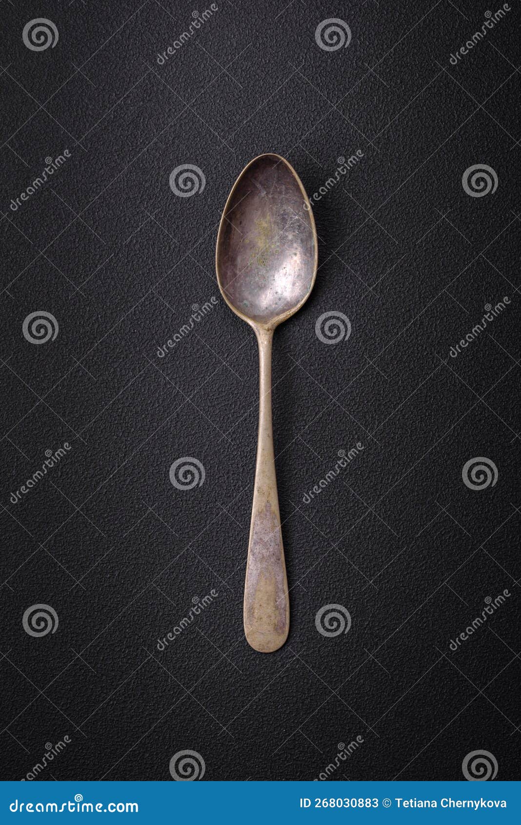 Empty Metal Spoon on Dark Textured Concrete Background Stock Image ...
