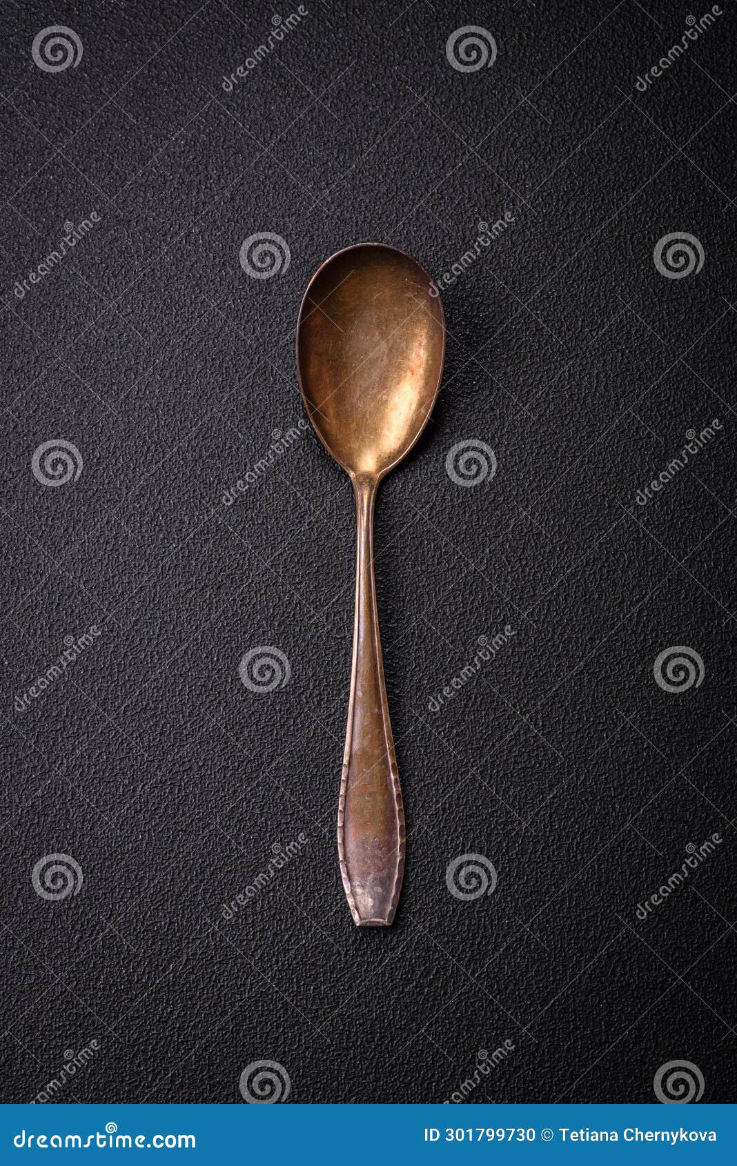 Empty Metal Spoon on Dark Textured Concrete Background Stock Photo ...