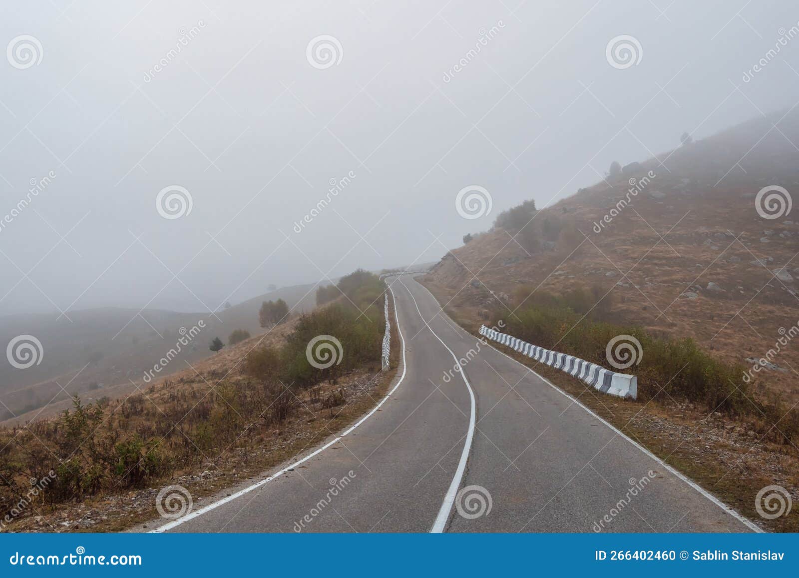 Empty Morning Mountain Highway in a Dense Fog. Road through a Dense Fog ...