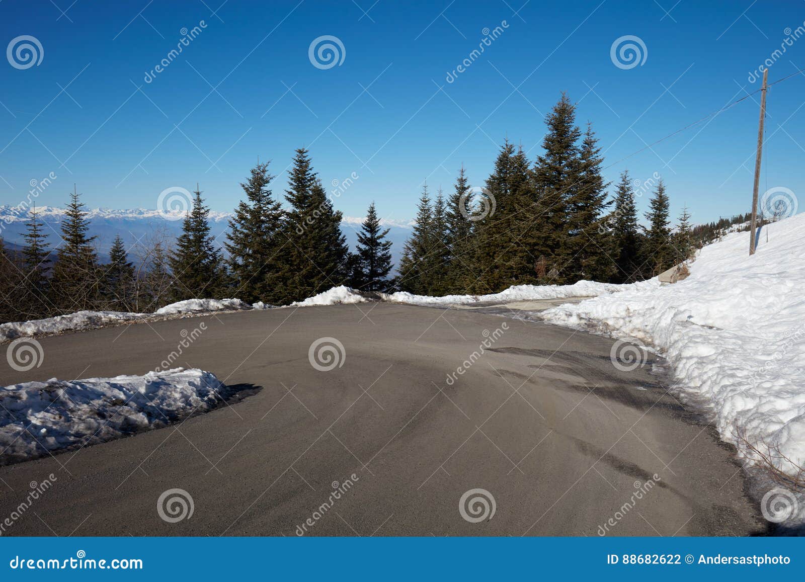 Empty Mountain Road Curve on Alps with Pine Trees and Snow Stock Photo ...