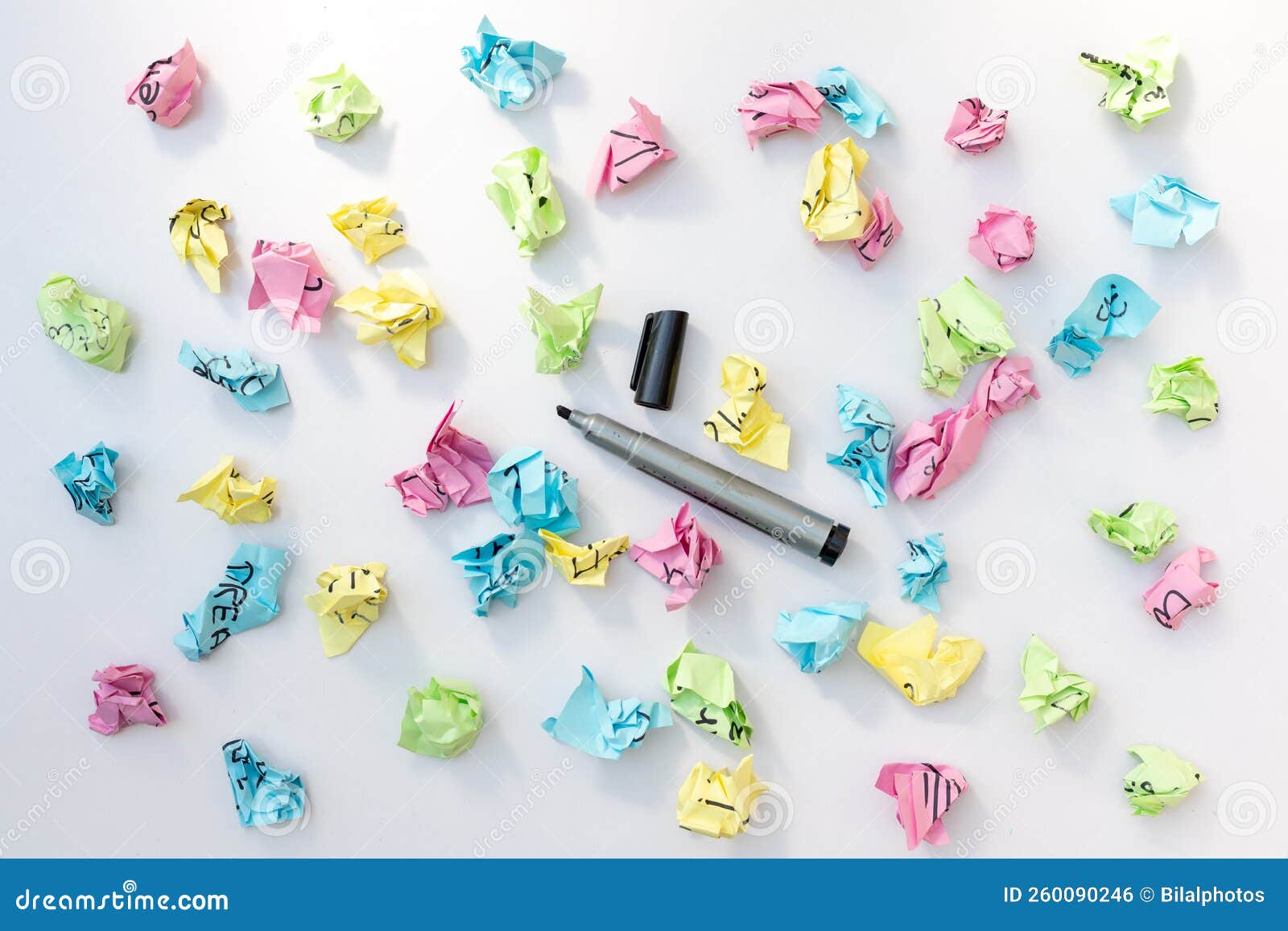 Empty Note Papers with a Black Marker and Crumbled Paper on White ...