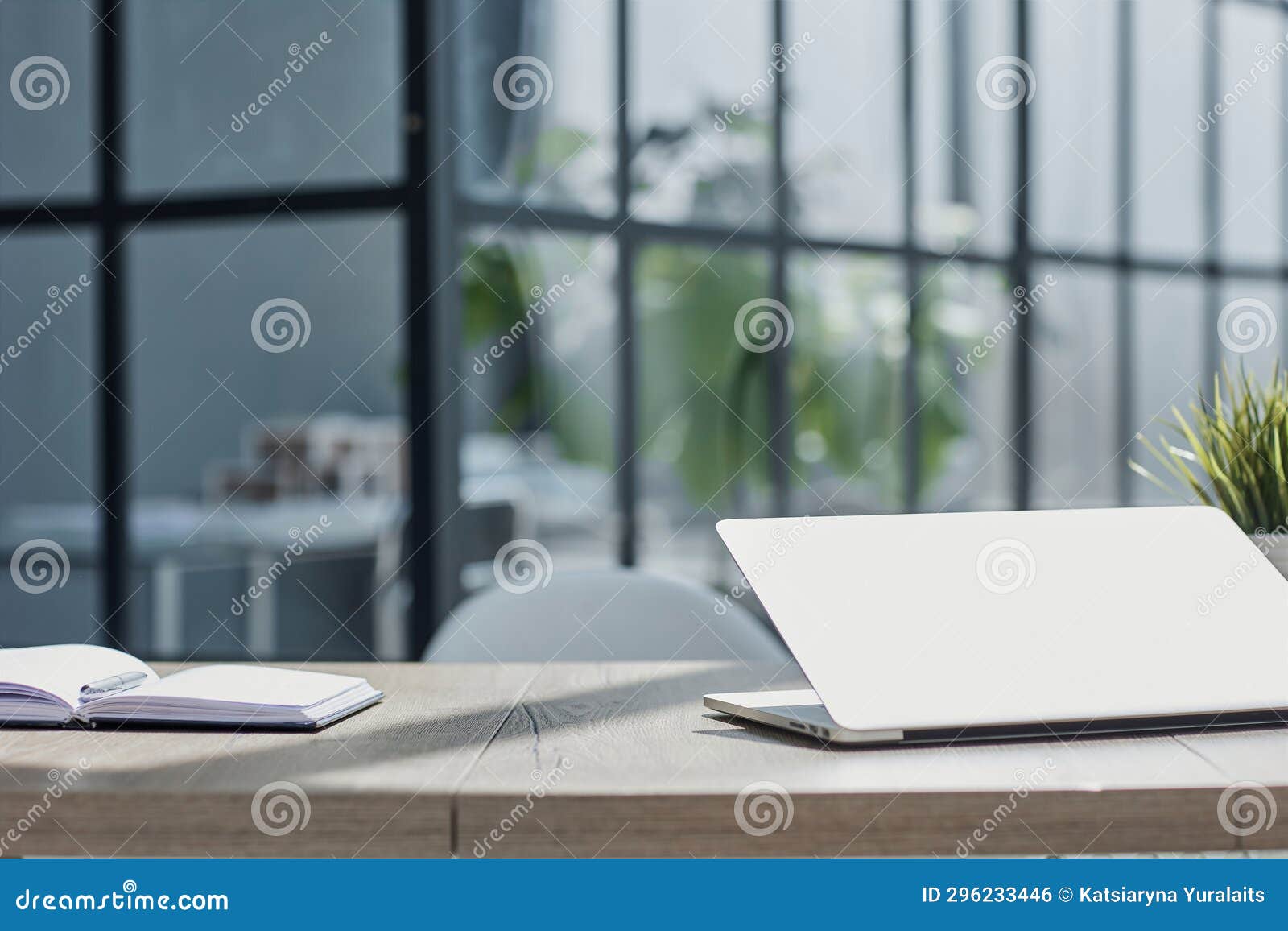 Empty Office Background. Ajar Laptop in the Foreground Stock Photo ...