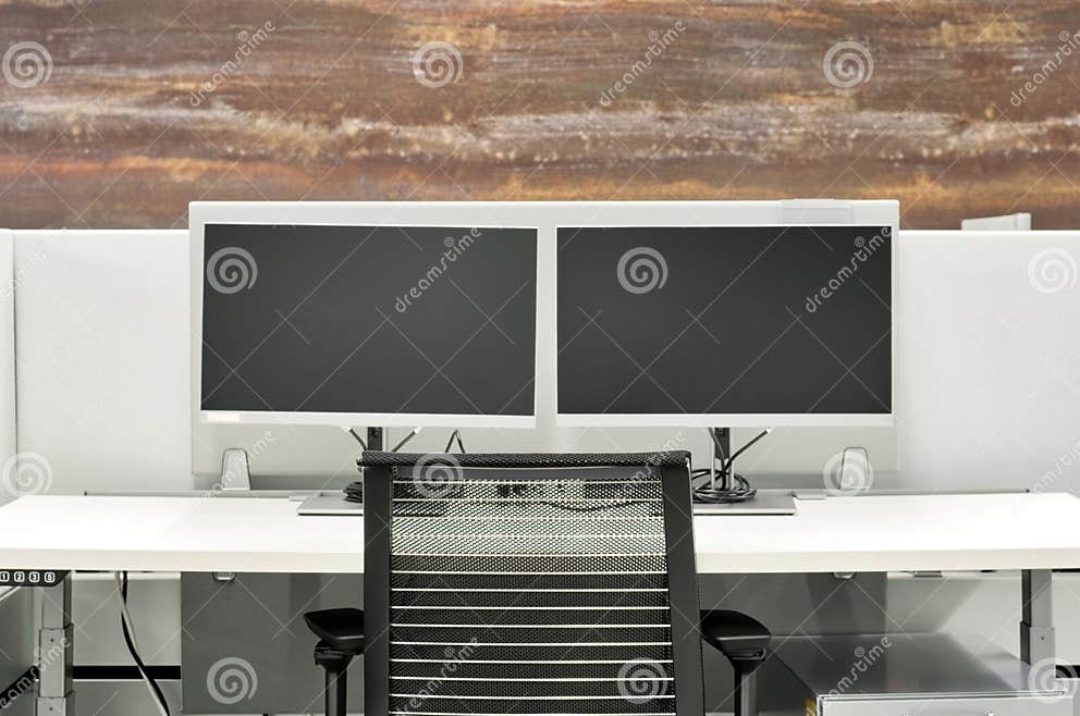 Empty Office Desk Space with Computer Monitors, Desk and Chair at a ...