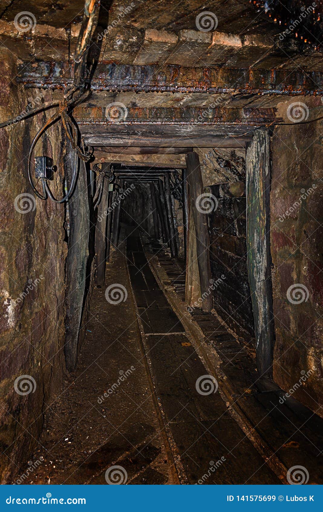 Empty Old Abandoned Mine Shaft with Wooden Timbering and Rusty Railway ...