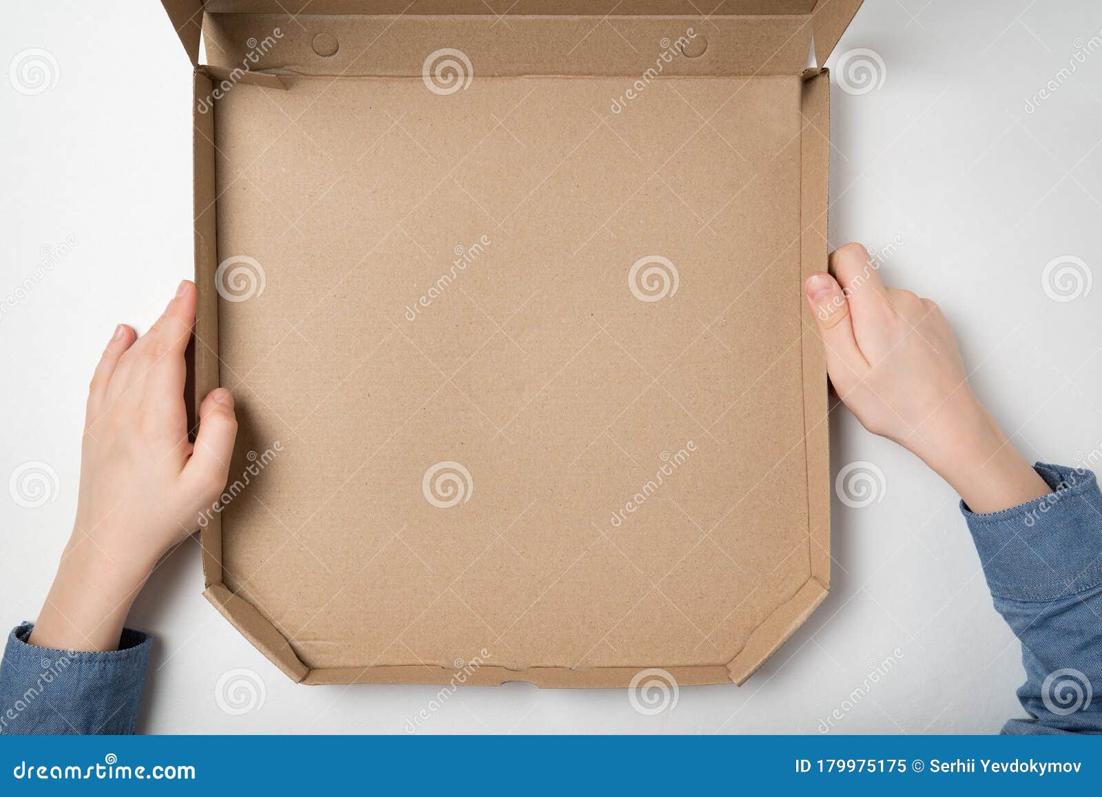 Empty Open Box of Pizza in Children`s Hands on White Background. Top ...