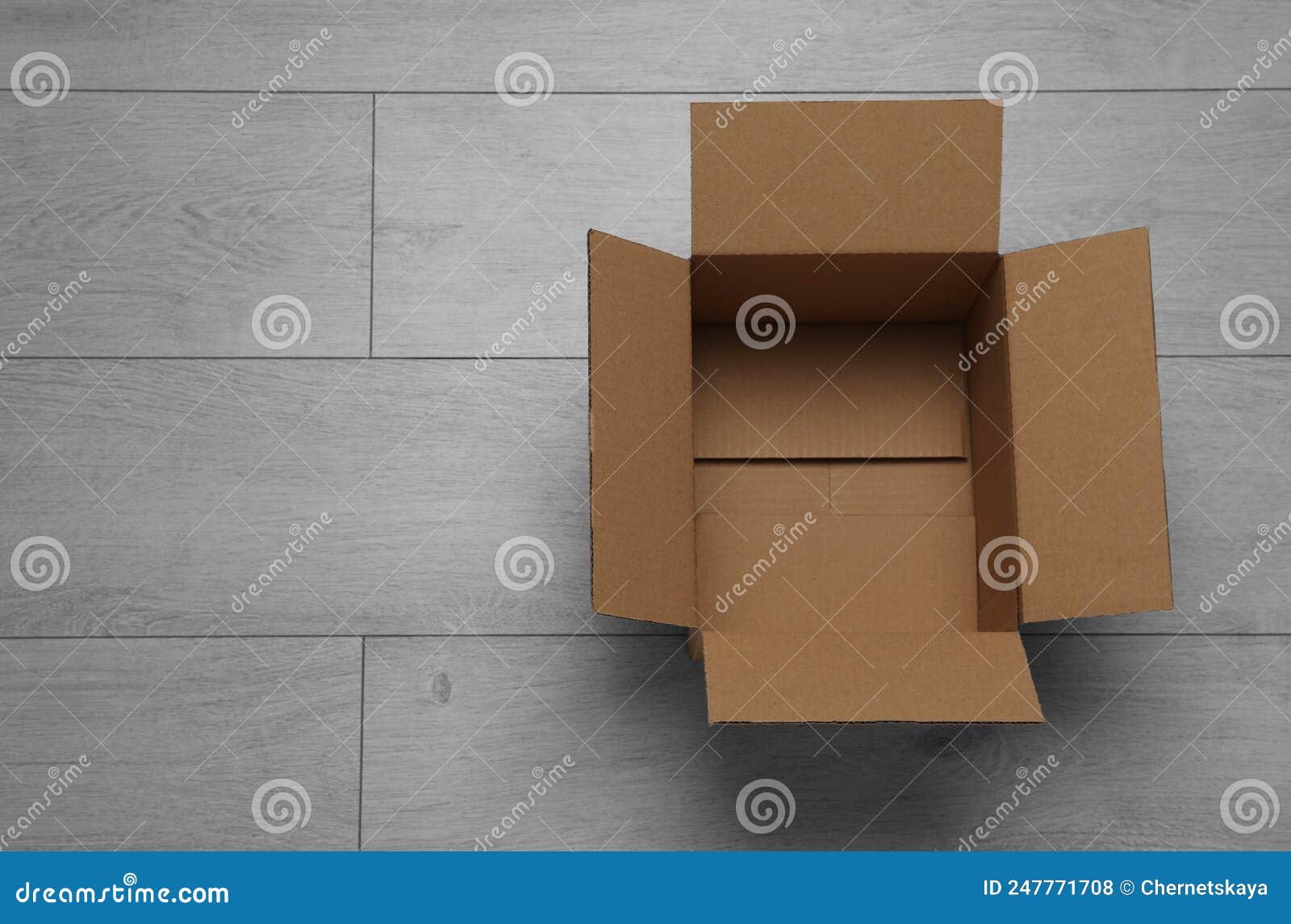Empty Open Cardboard Box on Floor, Top View. Space for Text Stock Photo ...