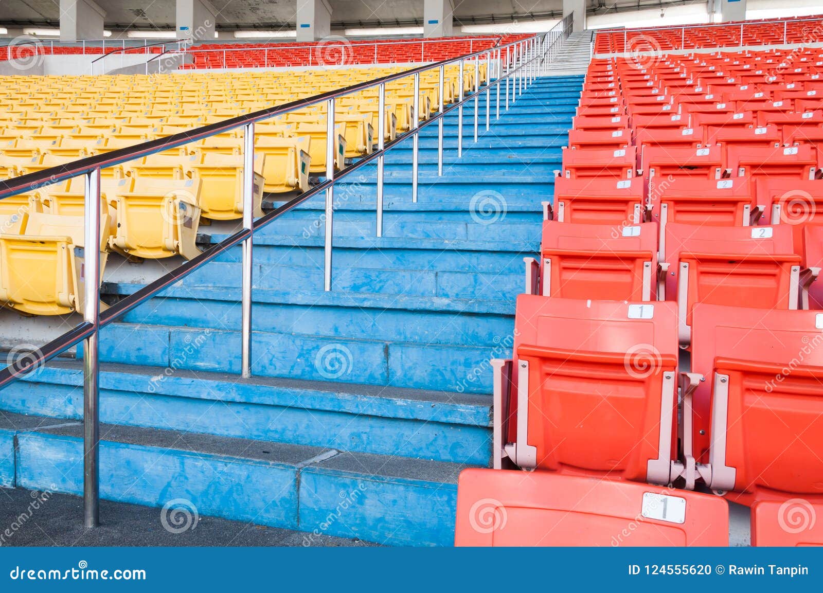 Empty Orange and Yellow Seats at Stadium,Rows Walkway of Seat on a ...