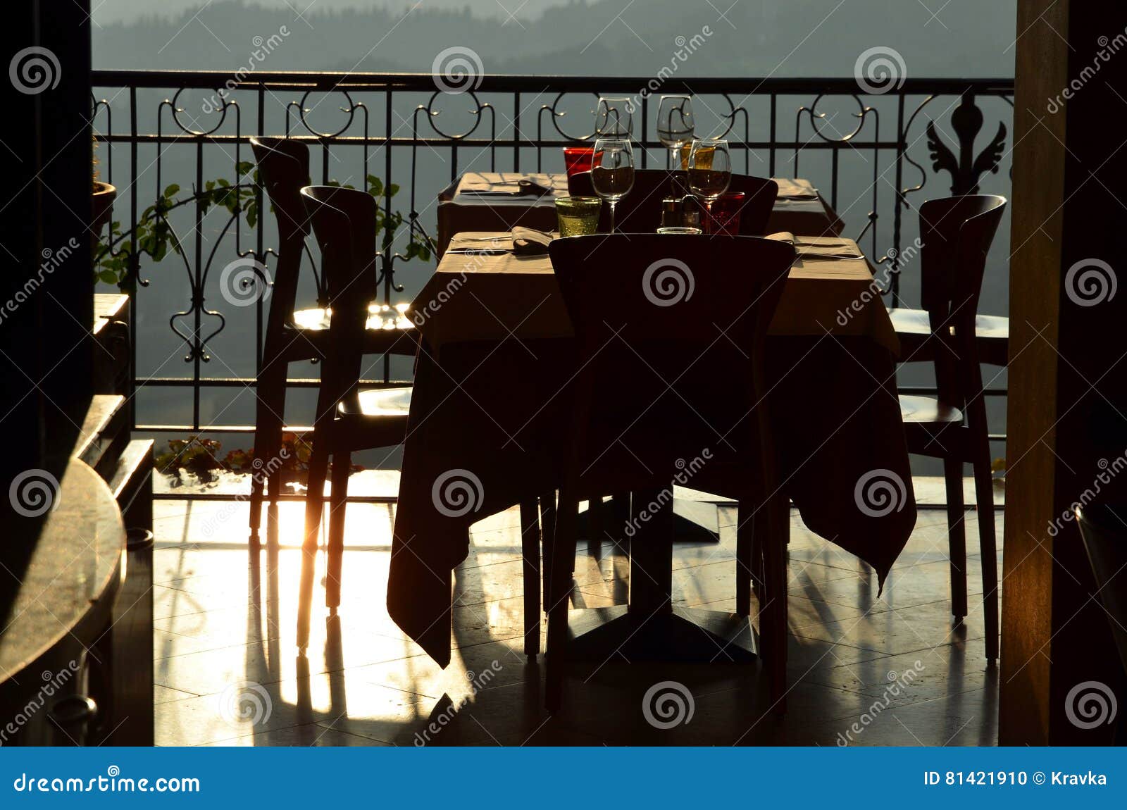 Empty Outdoor Restaurant Table at Sunset Stock Photo - Image of scene ...