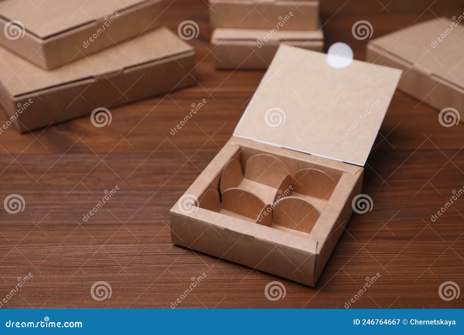 Empty Packaging Box with Dividers on Wooden Table. Production Line ...