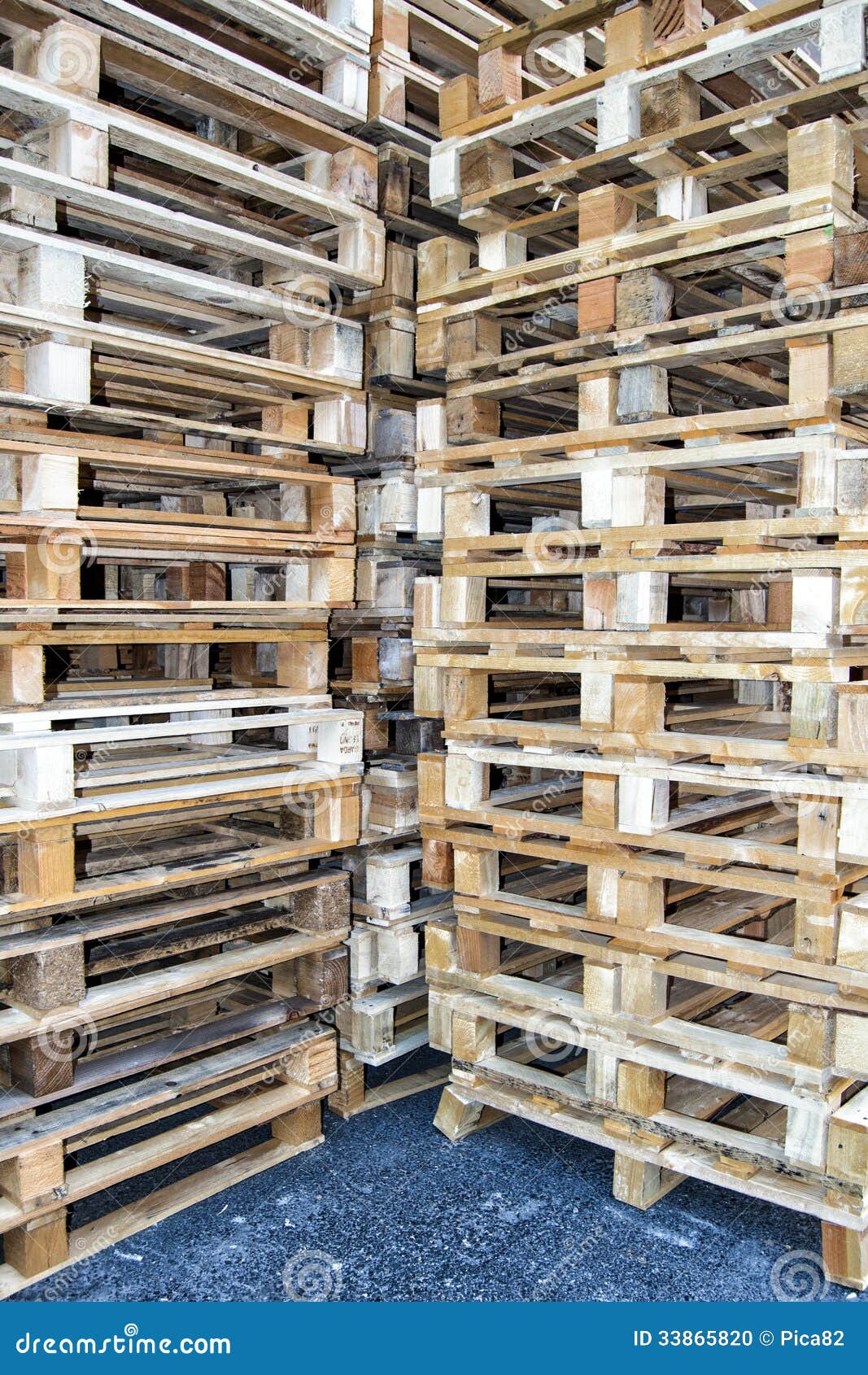 Empty Pallets Stacked in a Warehouse Stock Photo - Image of heap ...
