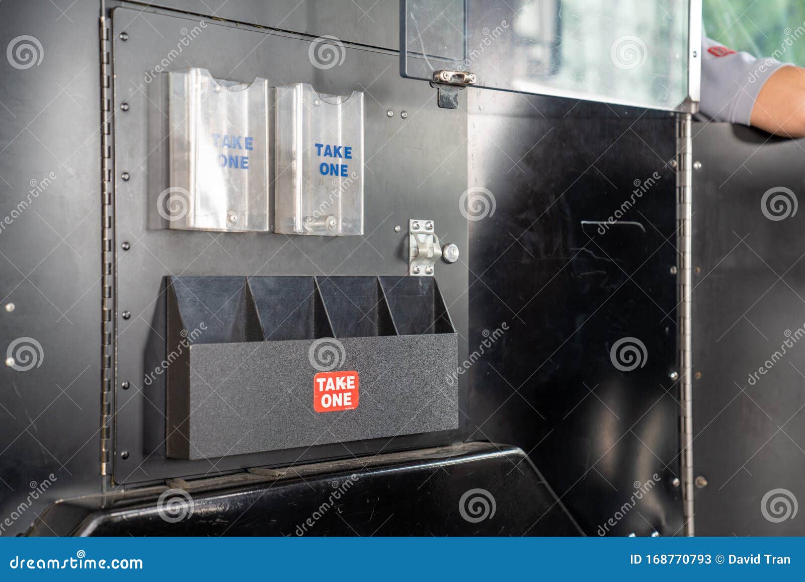 Empty Pamphlet Holders with Take One Labels Hanging on Side of Bus ...