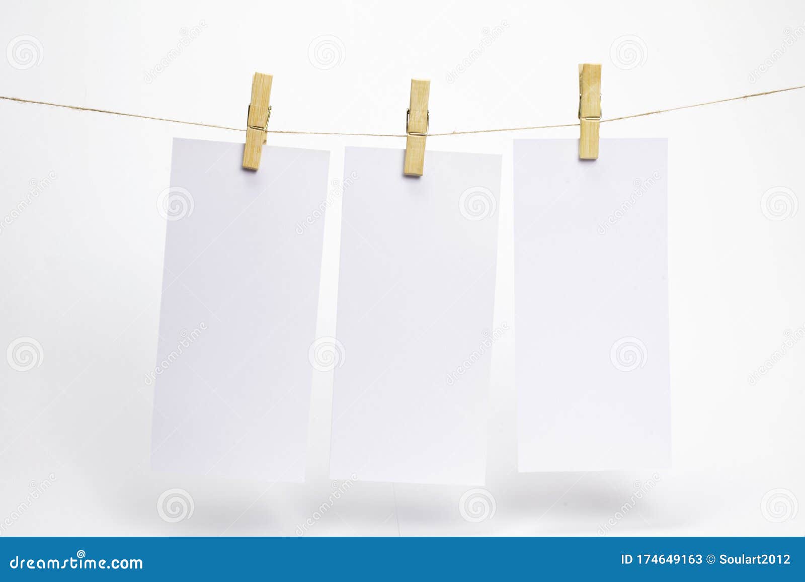 Empty Paper Frames that Hang on a Rope with Clothespins and on White ...
