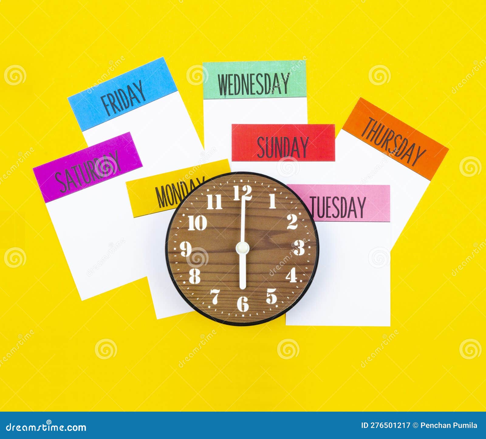 The Empty daily Paper Note and Wooden Clock on Yellow Background Stock ...