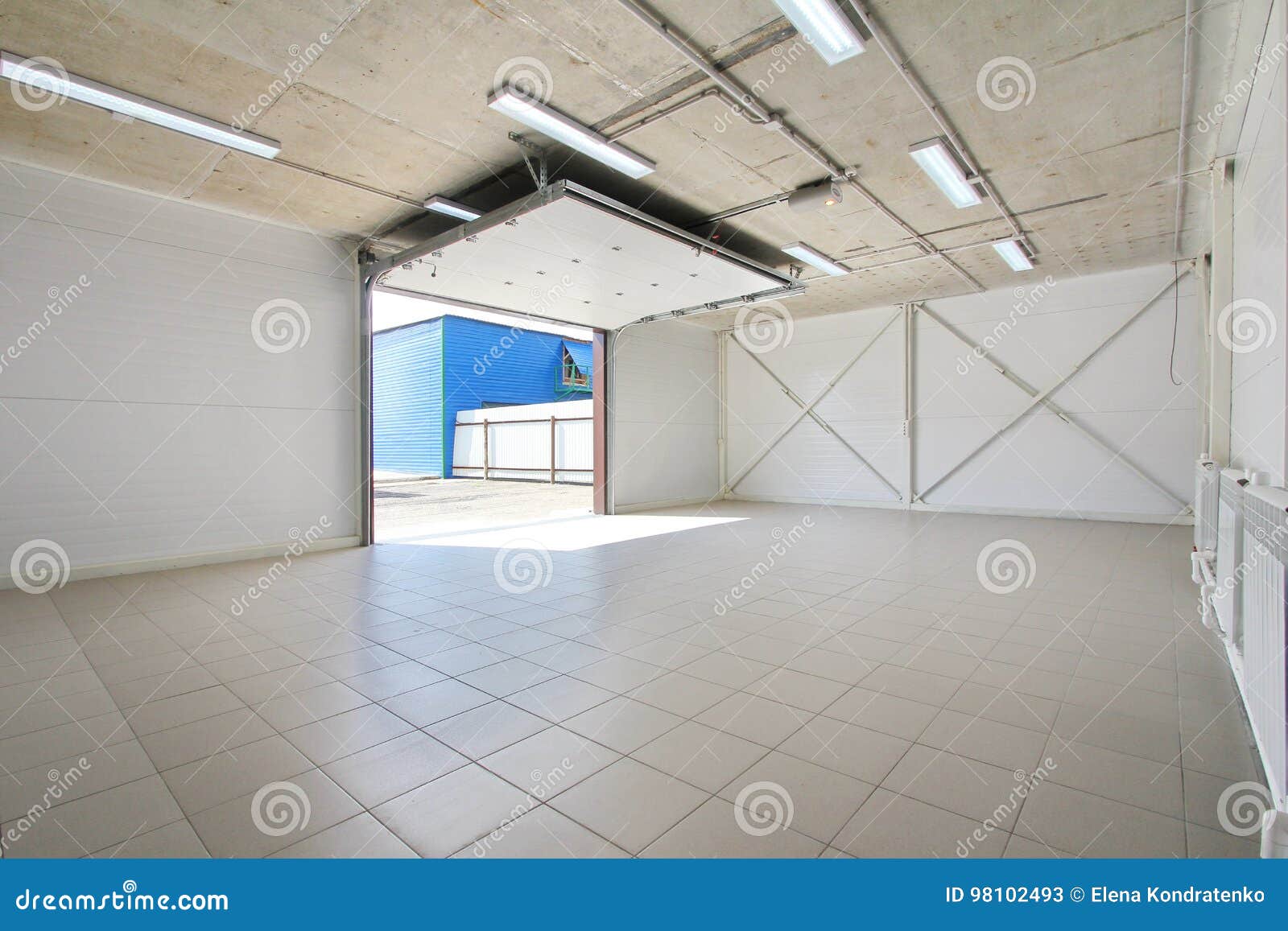 Empty Parking Garage, Warehouse Interior with Large White Gates and ...