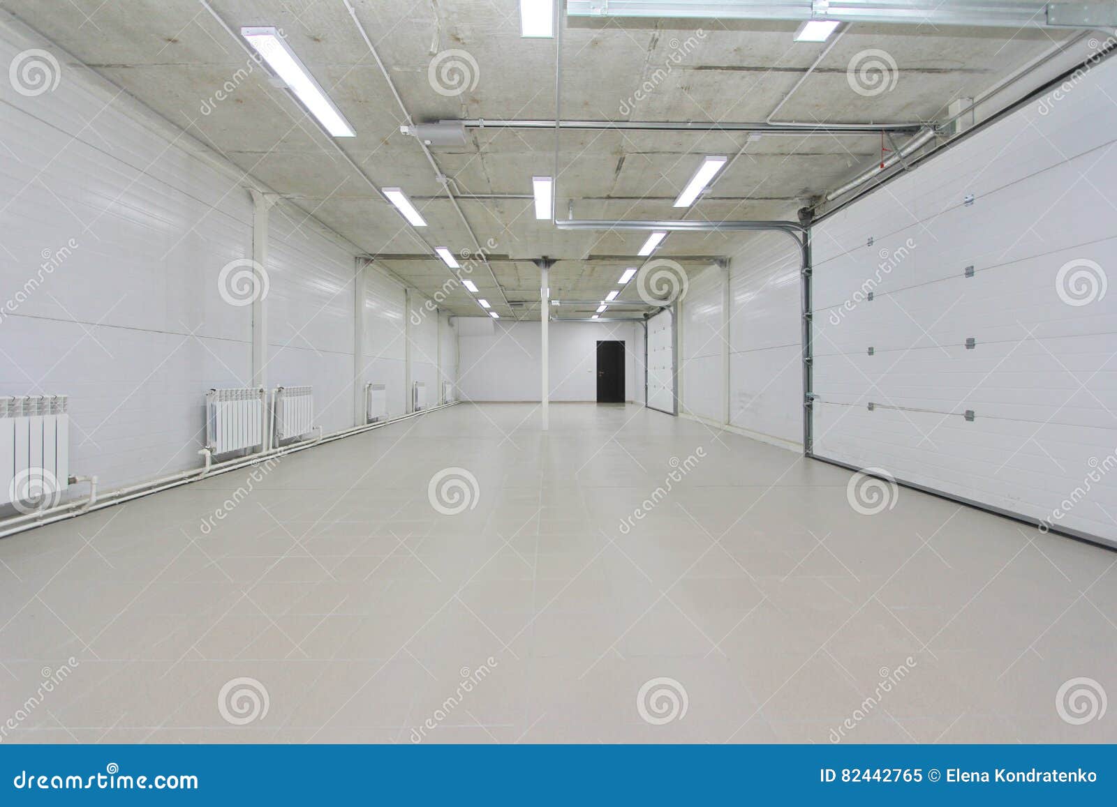 Empty Parking Garage, Warehouse Interior with Large White Gates and ...