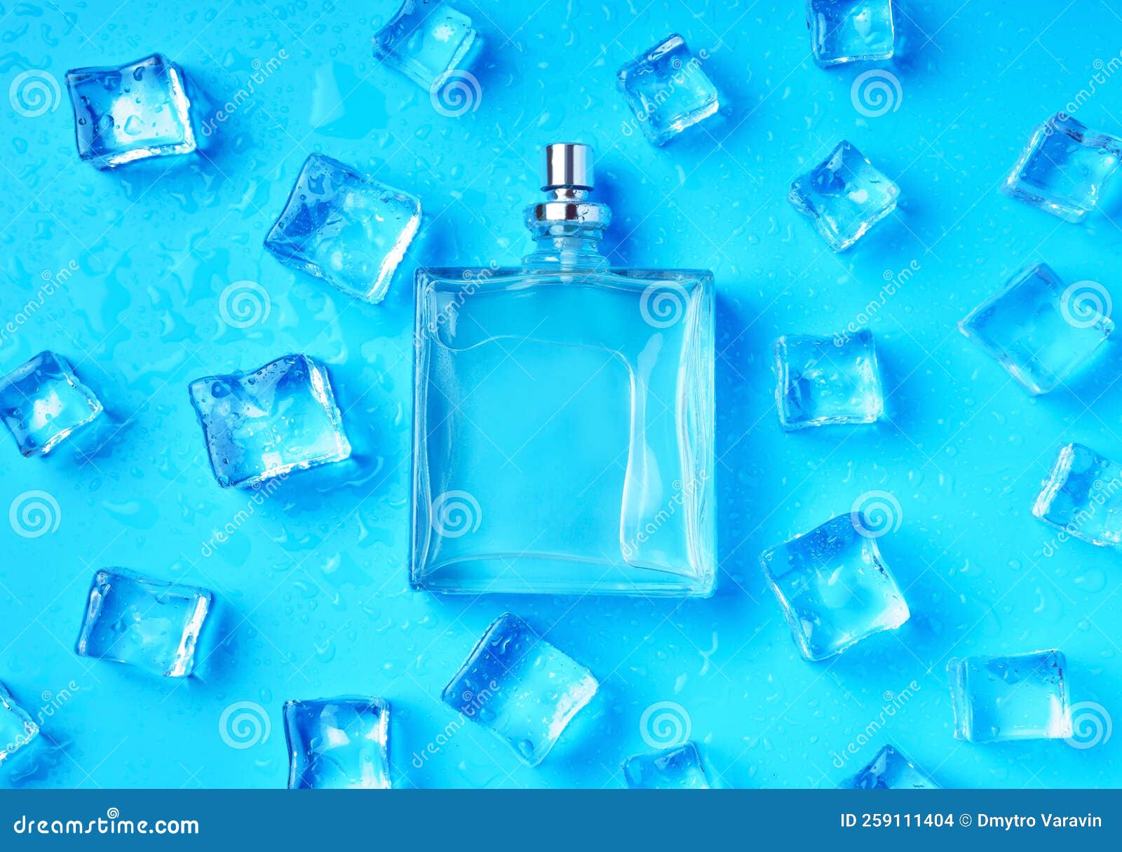 Empty Perfume Bottle Lying on a Frosty Backdrop with Ice Cubes. Stock ...