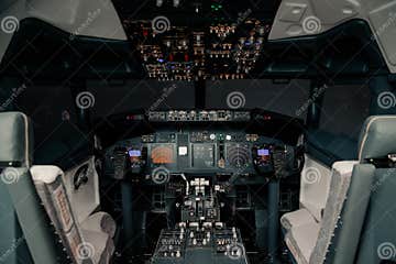 Empty Pilot Cockpit with Switched on Flight Deck Dashboard in Night ...