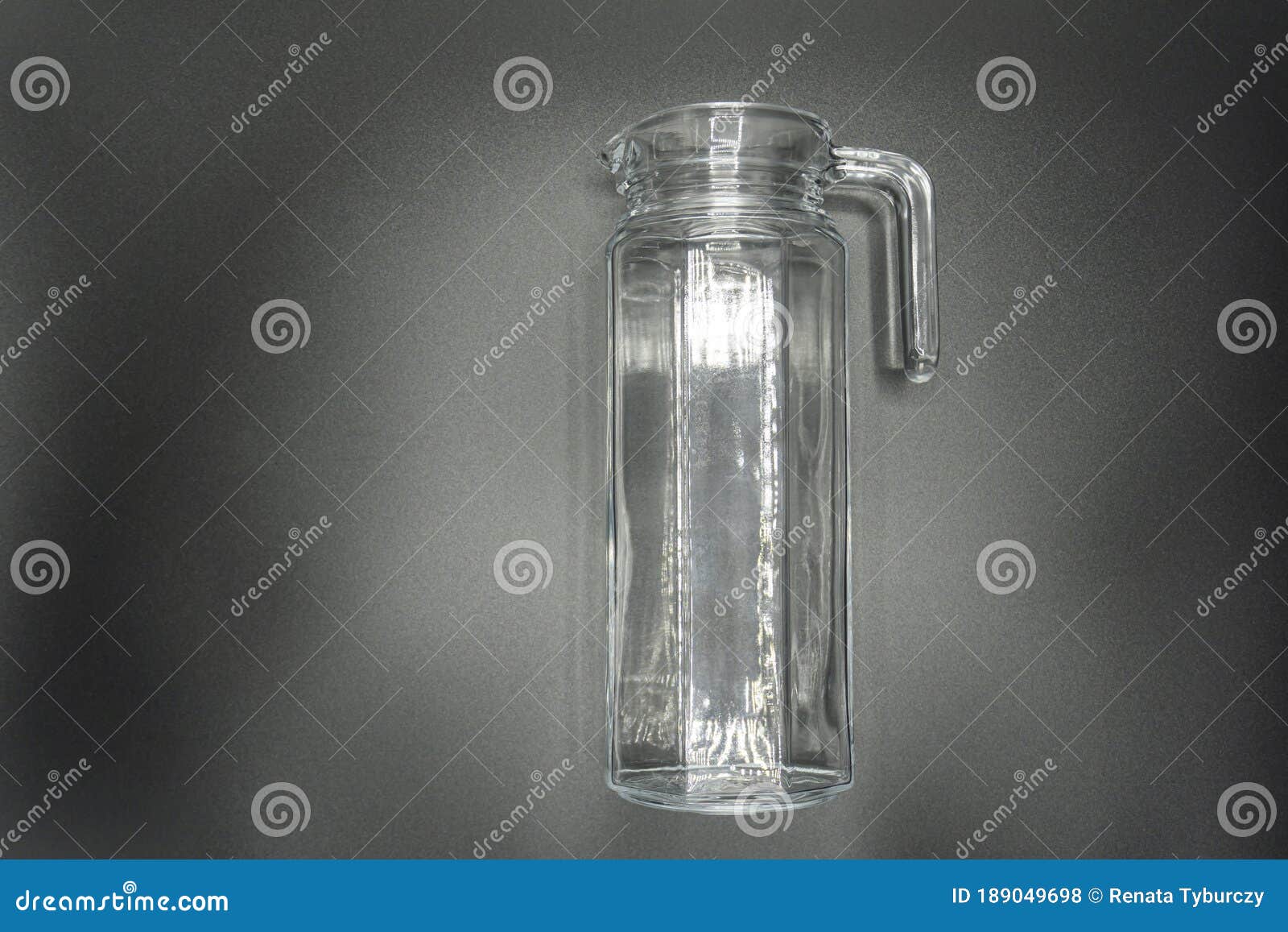 Empty Pitcher, Glass Jug Isolated on Gray Background Stock Photo ...
