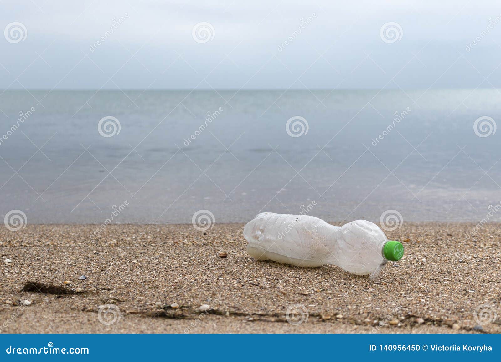 Empty Plastic Bottle on the Sand. Garbage on the Beach. Sea Shore Stock ...