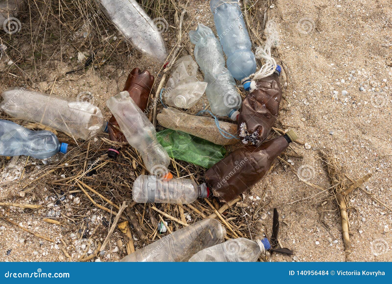 Empty Plastic Bottles on the Sand. Garbage on the Beach. Dirty Sea ...