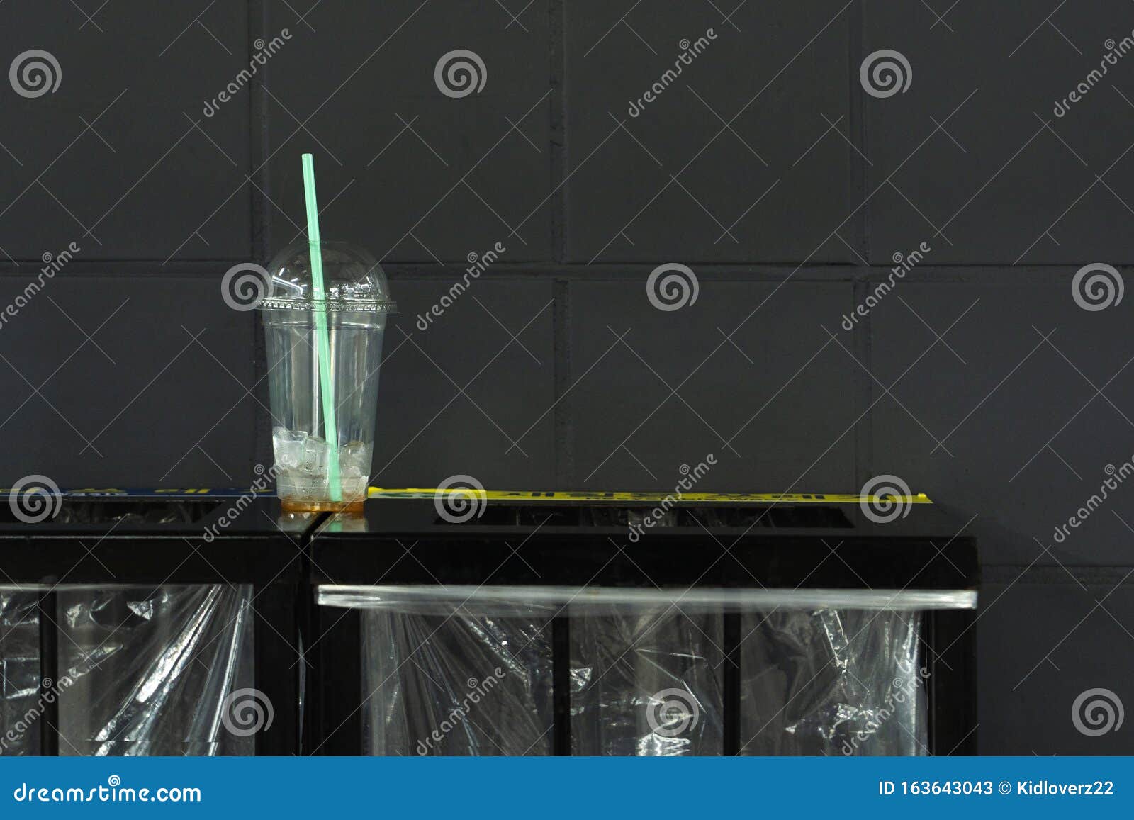 Empty Plastic Cup and Straw on a Trash Bin at the Subway Station in ...