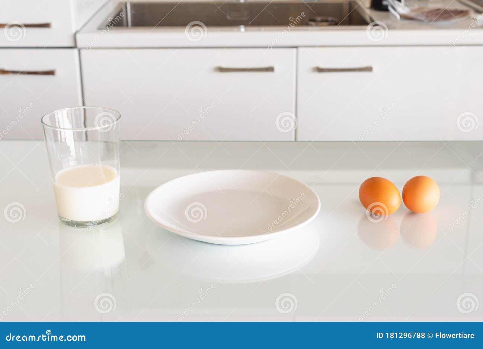 Empty Plate on the Kitchen Table, Eggs and Glass of Milk Ready Cooking ...