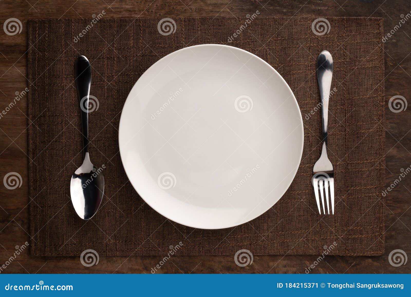 Empty Plate Spoon Fork and Knife on Table. Table Setting on Wooden ... Empty Plate Spoon Fork and Knife on Table. Table Setting on Wooden ...