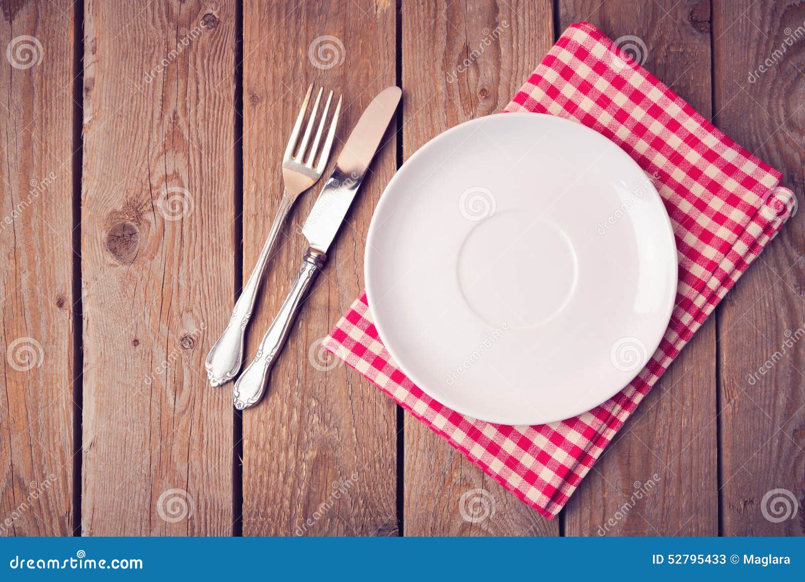 Empty Plate on Tablecloth on Wooden Table. View from Above Stock Image ...