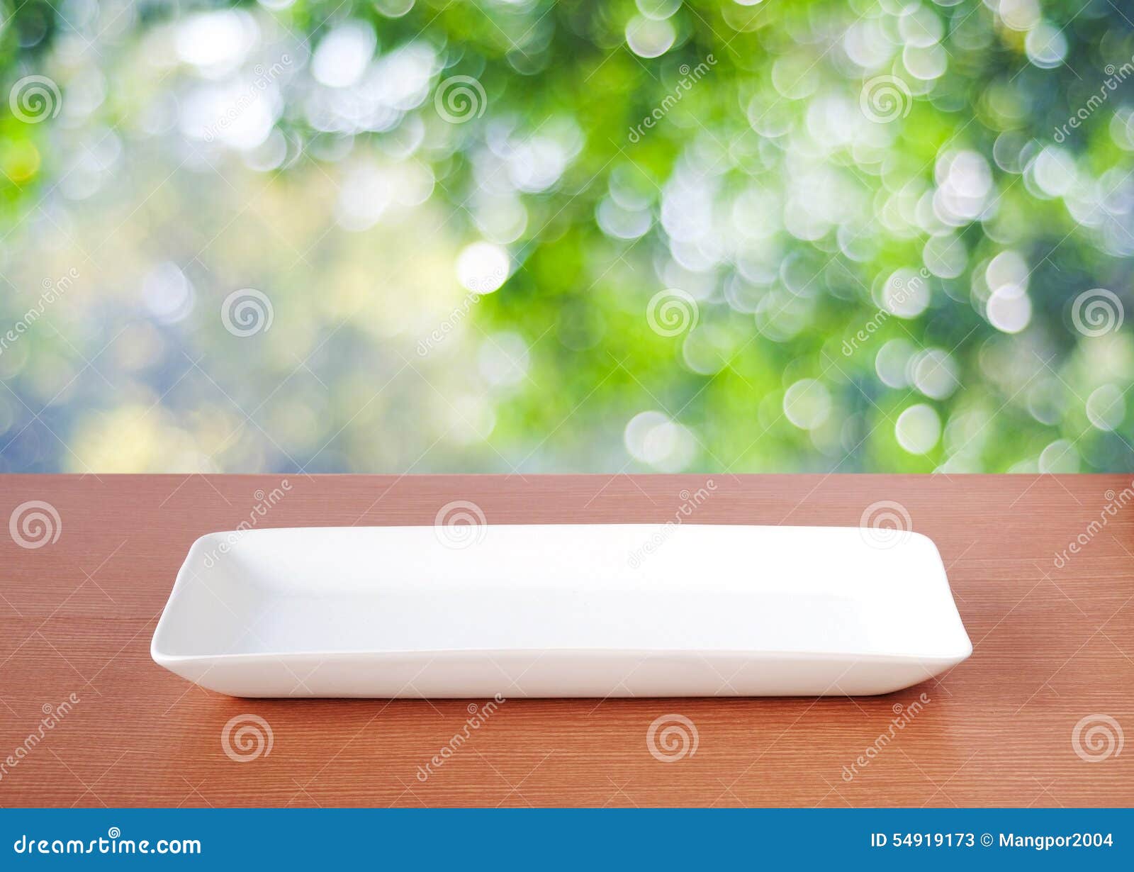 Empty Plate on Wood Table Over Blurred Tree Background, Food and Stock ...