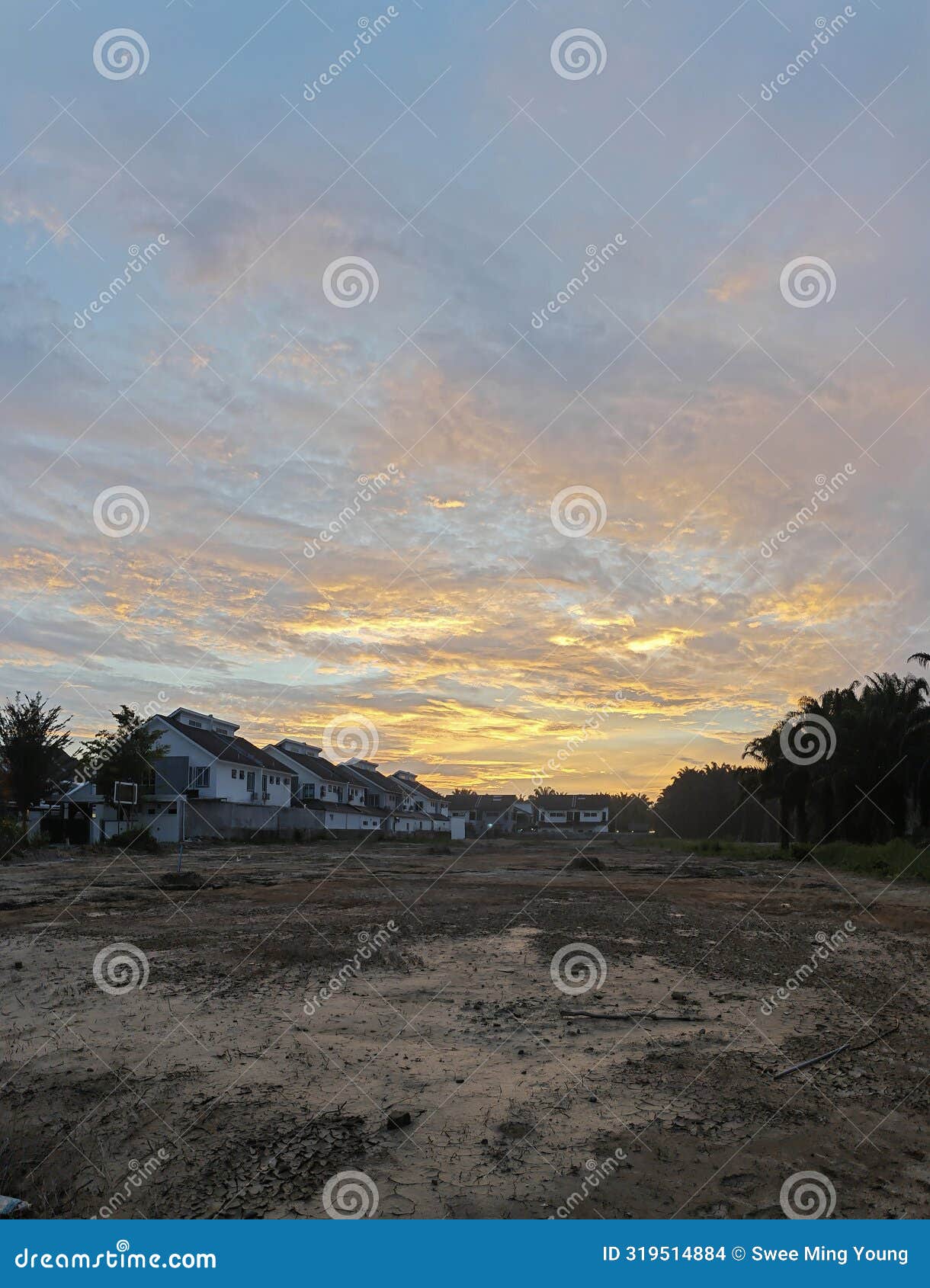 An Empty Plot of Land Scene Besides a Residential Row of Houses. Stock ...