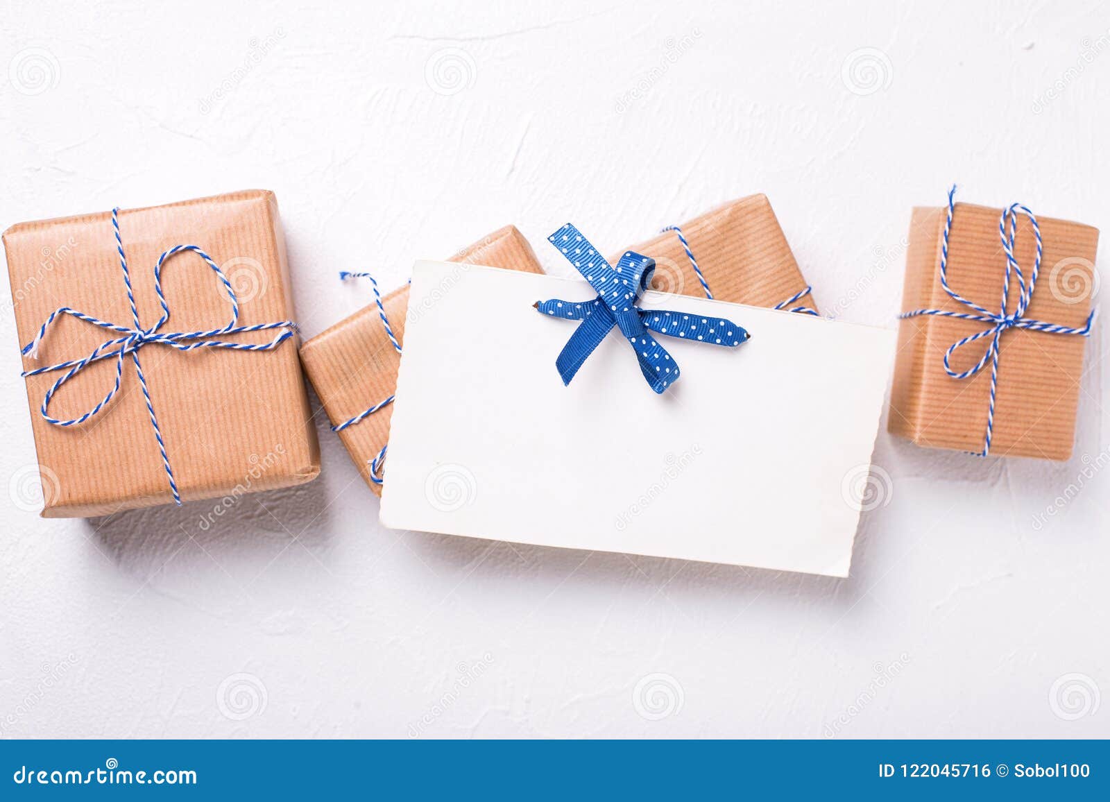 Empty Postcard and Wrapped Gift Boxes with Presents on Textur Stock ...