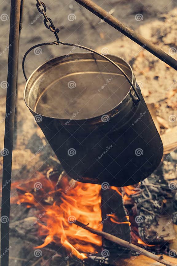 Empty Pot Hanging Over a Burning Fire Stock Photo - Image of close ...