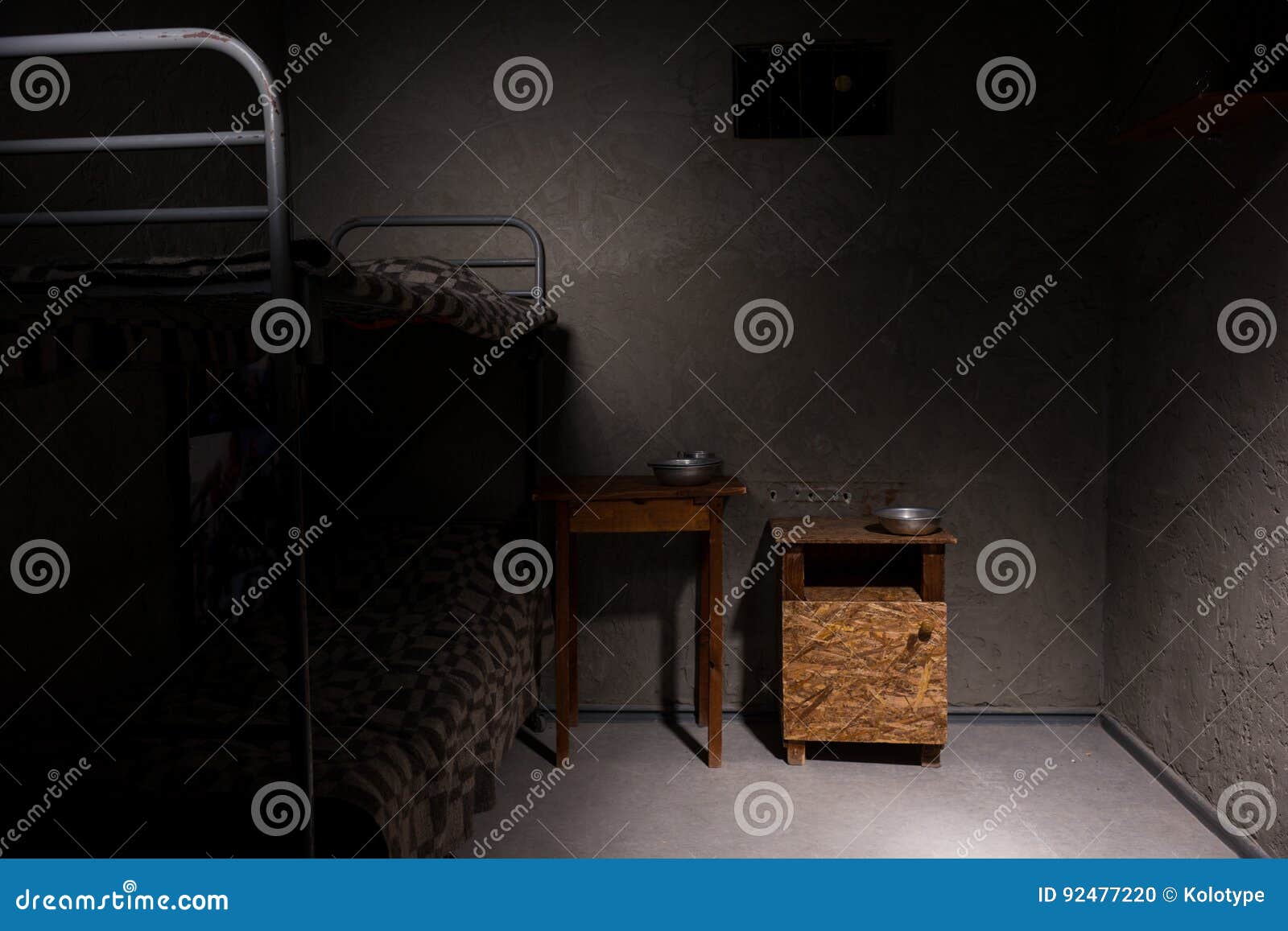 An Empty Prison Cell with Bunk Bed and Bedside Table Stock Photo ...