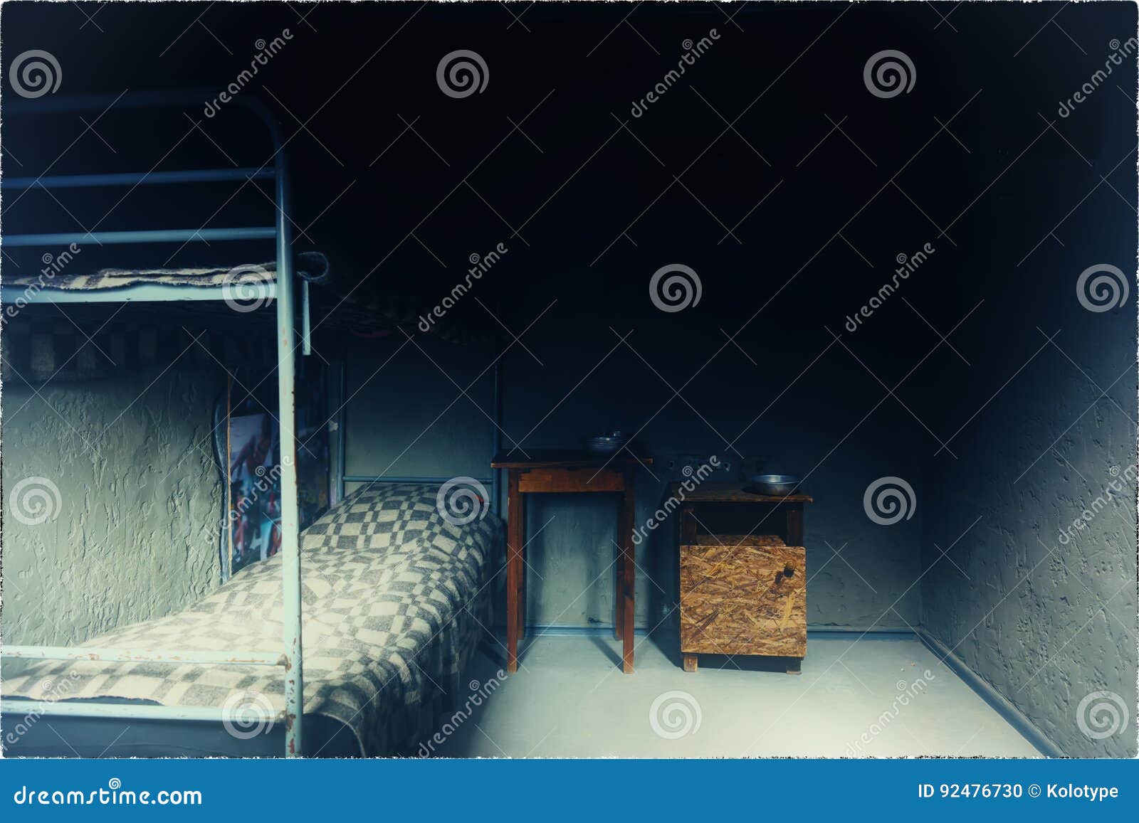 Empty Prison Cell with Iron Bunk Bed and Bedside Table Stock Photo ...