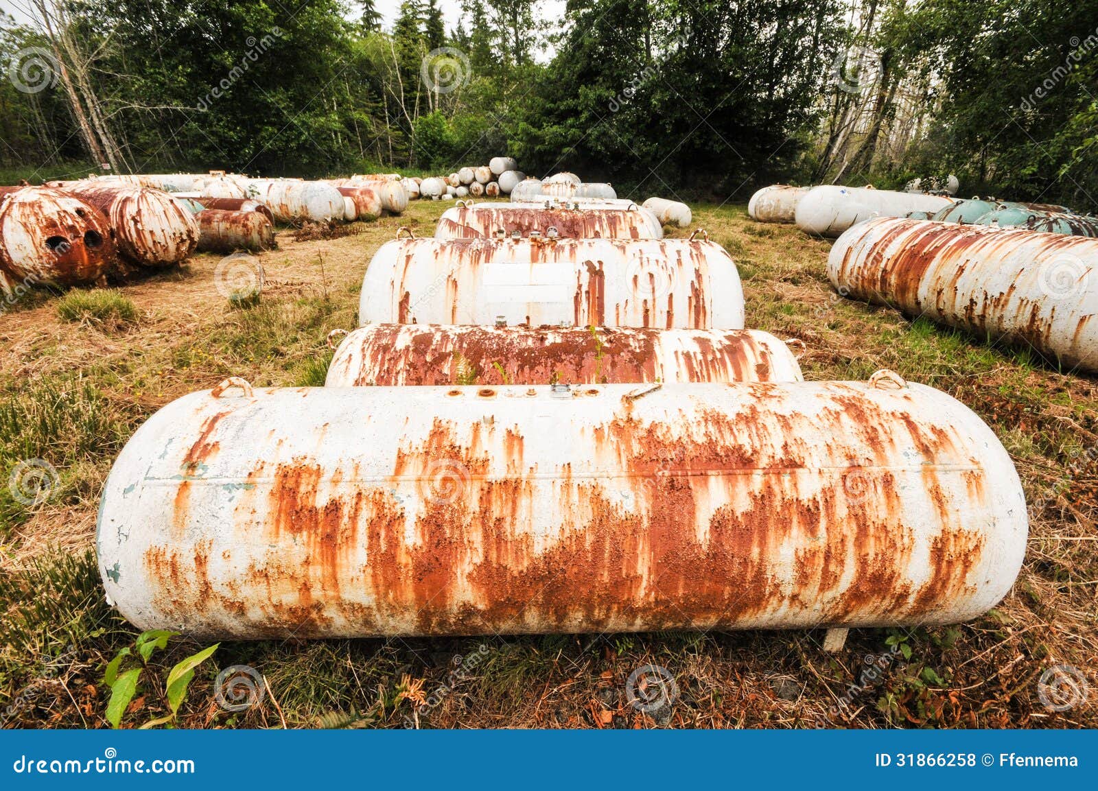 Empty Propane Storage Tanks Litter a Field Stock Photo - Image of ...