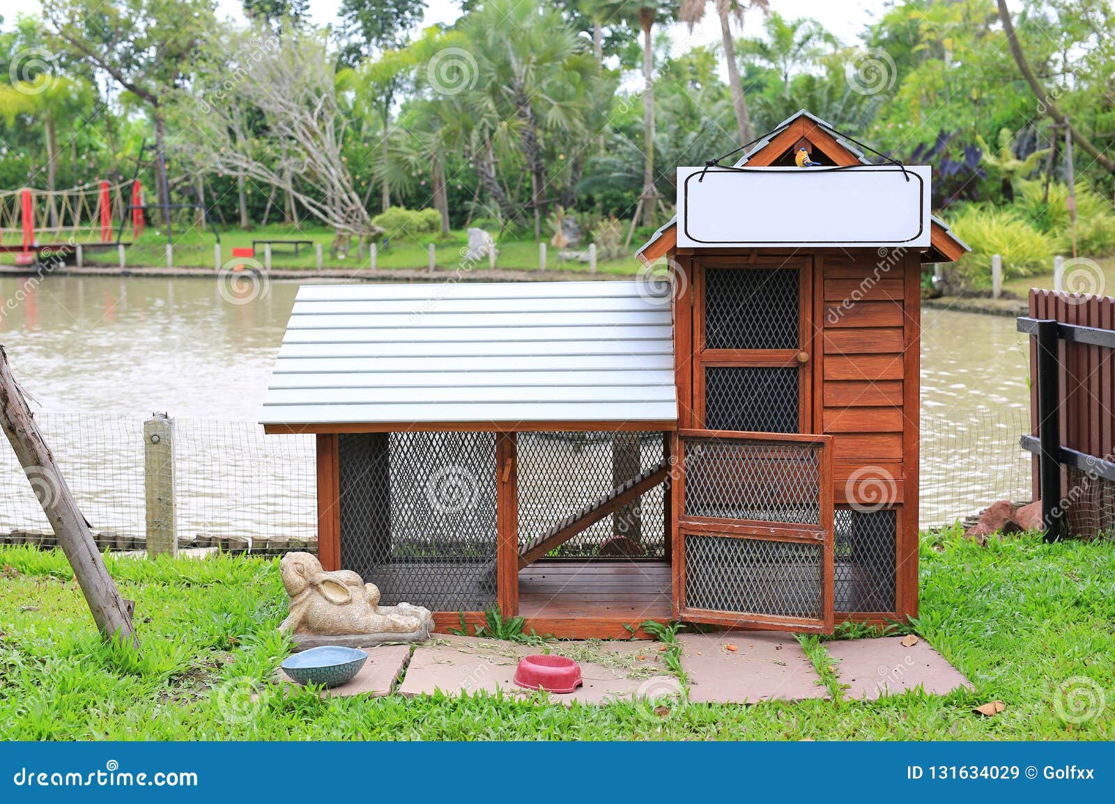 Empty Rabbit House in Green Garden Stock Image - Image of grid, gray ...