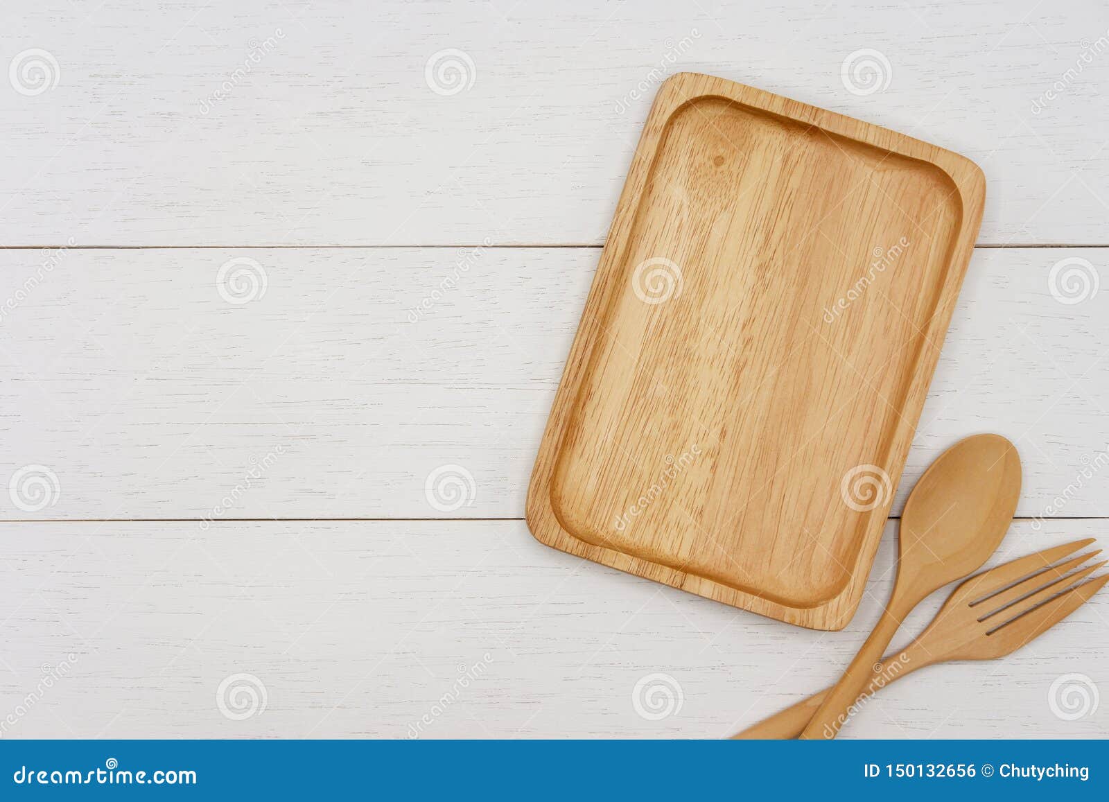 Empty Rectangle Wooden Plate with Spoon and Fork on White Wooden Table ...