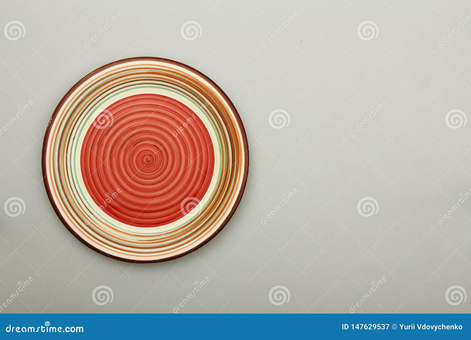 Empty Red Ceramic Dish Plate with Spiral Pattern on Gray Background ...